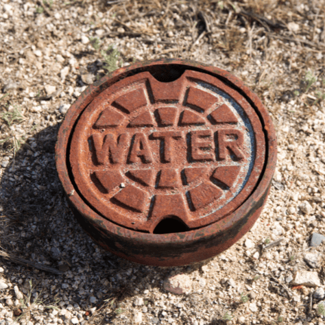Switching between tank water and mains water supply